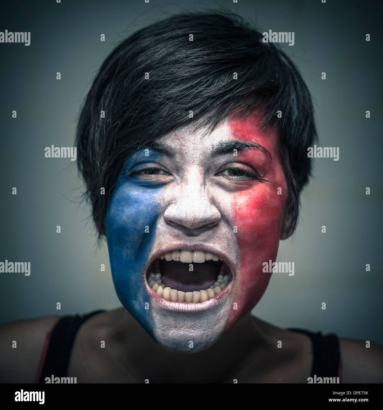 Portrait of angry woman with flag of France painted on face Stock Photo ...