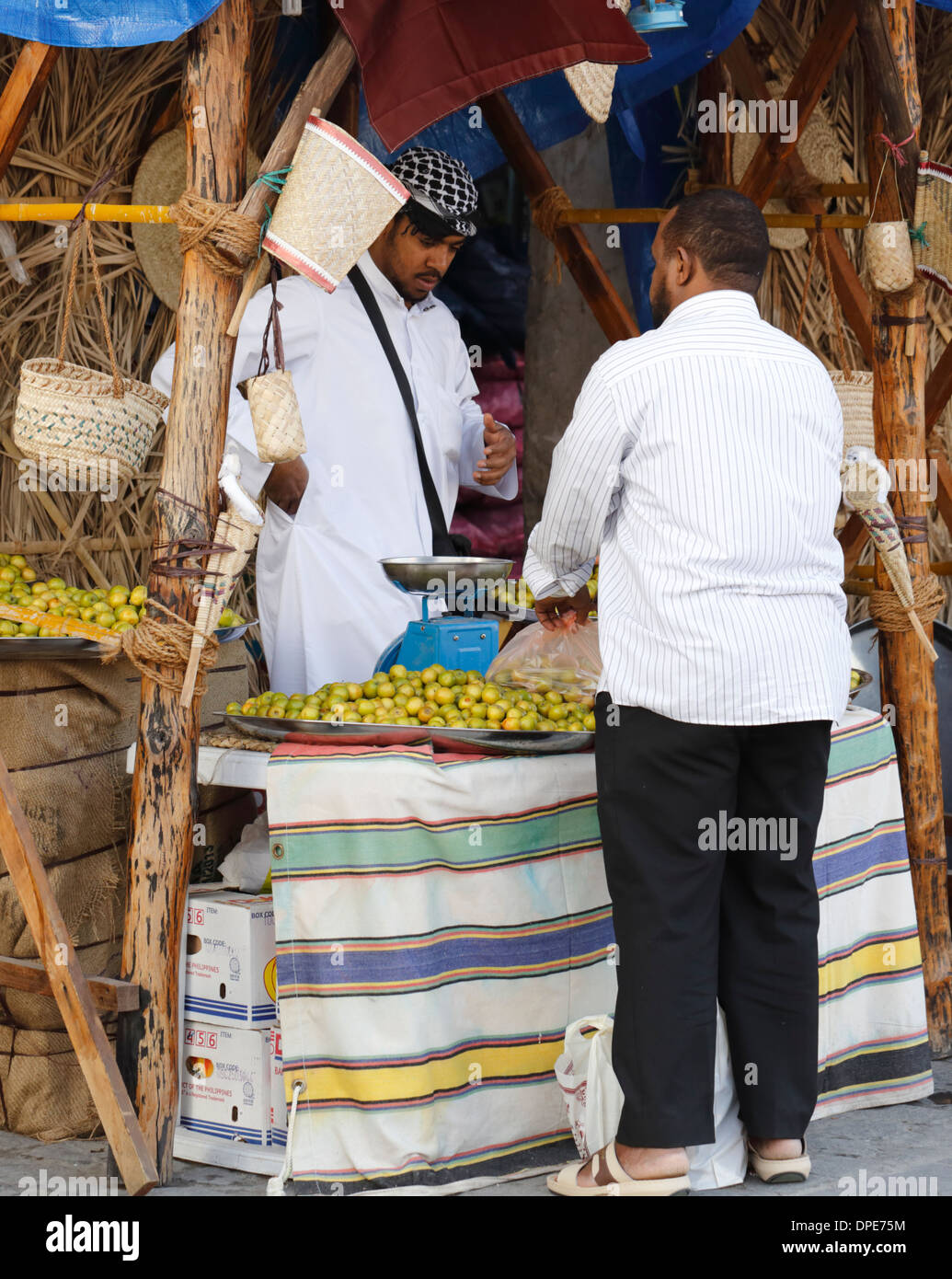 Locally grown fruits being sold at a makeshift stall in Souq Waqif ...