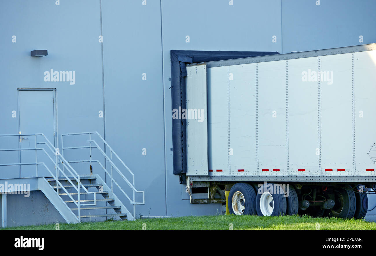 Semi Truck Delivery. Truck Trailer in Warehouse Dock Stock Photo - Alamy