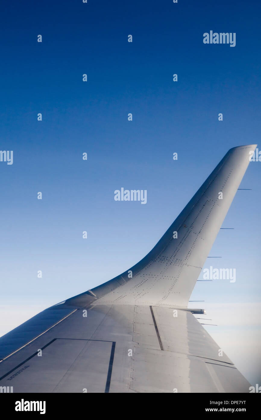 Vertical image of an airplane wing, taken from inside the airplane ...