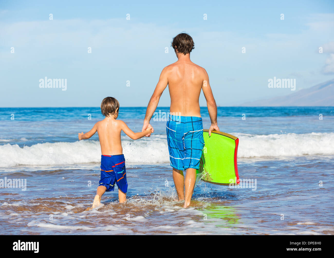 Father and Son Going Surfing Together on Tropical Beach in Hawaii Stock ...