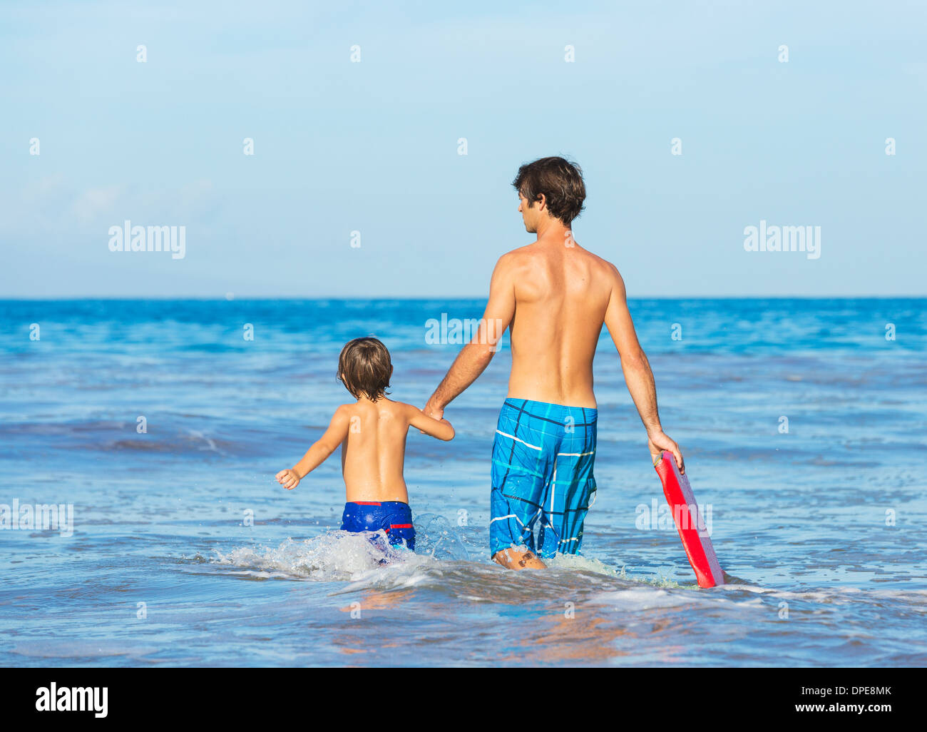 Father and Son Going Surfing Together on Tropical Beach in Hawaii Stock ...