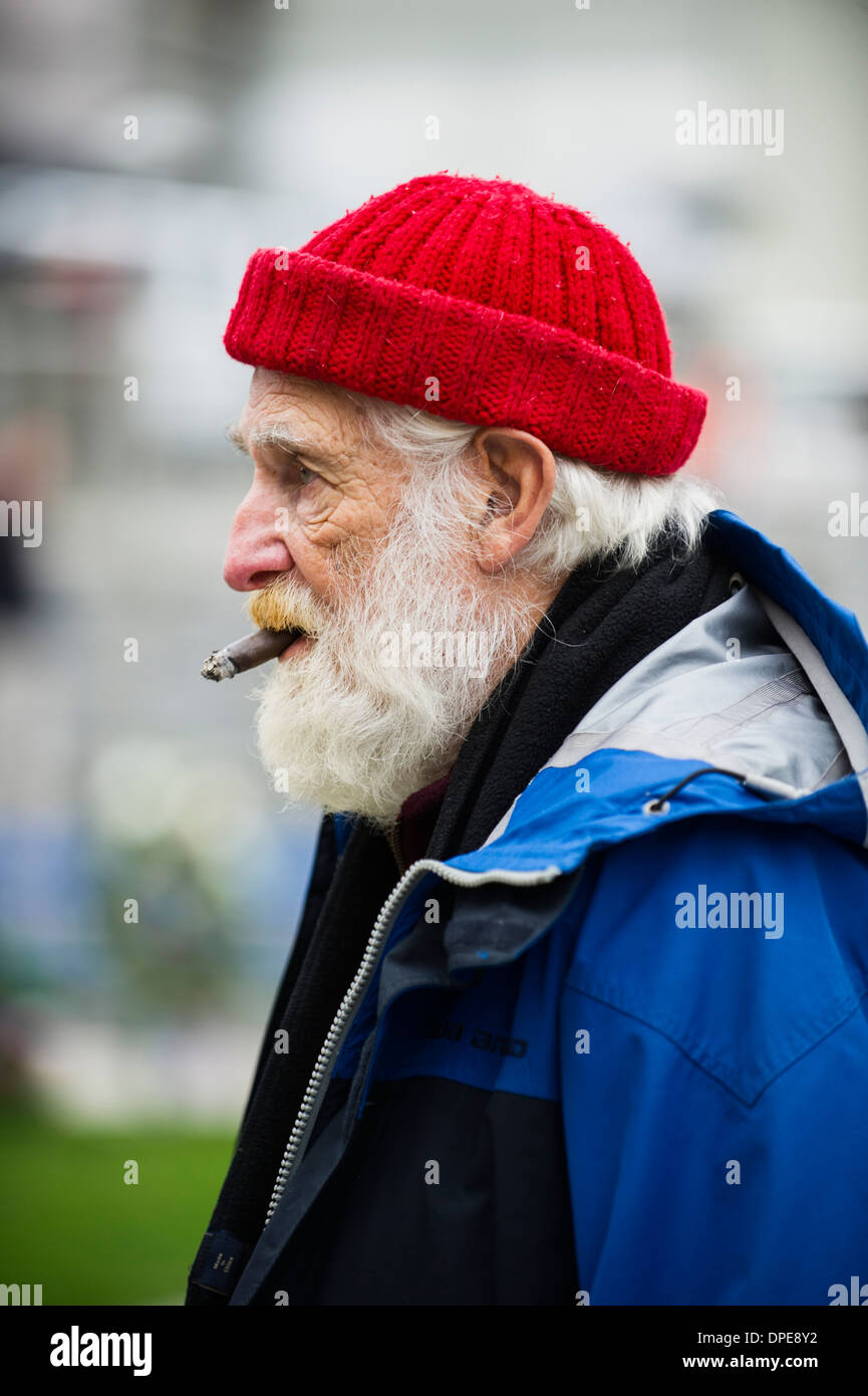 Older man in a toque smoking a cigar Stock Photo - Alamy