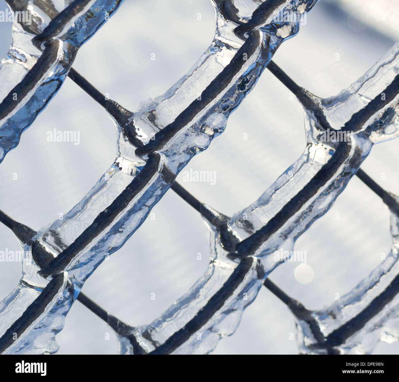 Ice coated chain link fence from an ice storm Stock Photo - Alamy