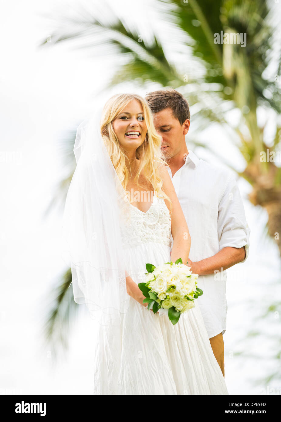 Married couple, bride and groom getting married, Tropical wedding in ...