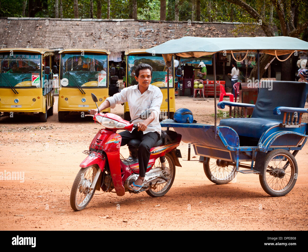 A Cambodian tuk-tuk and tuk-tuk driver at Angkor Thom, Cambodia. A tuk ...