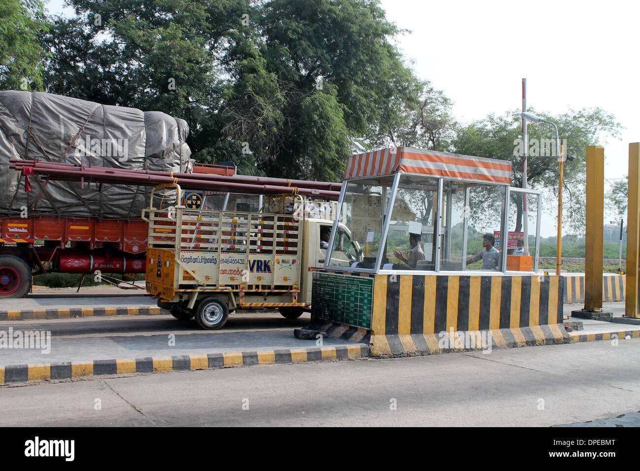 Vehicles waiting at a toll gate, NH 7, India Stock Photo - Alamy