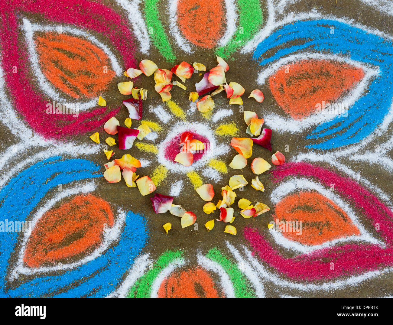Rangoli festival coloured powder design and flower petals in an Indian ...
