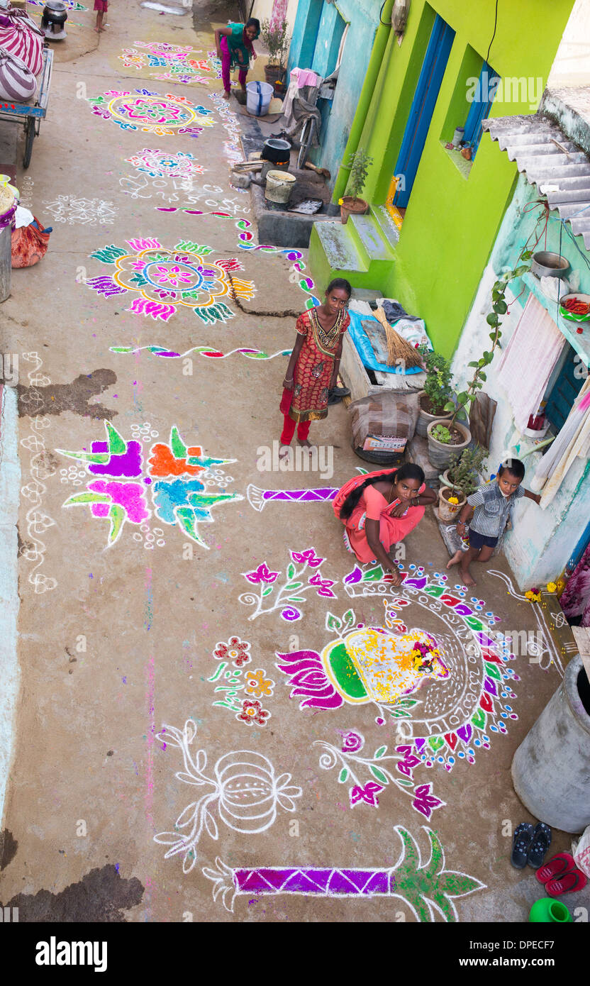 Rural Indian village street covered with decorative Rangoli festival ...