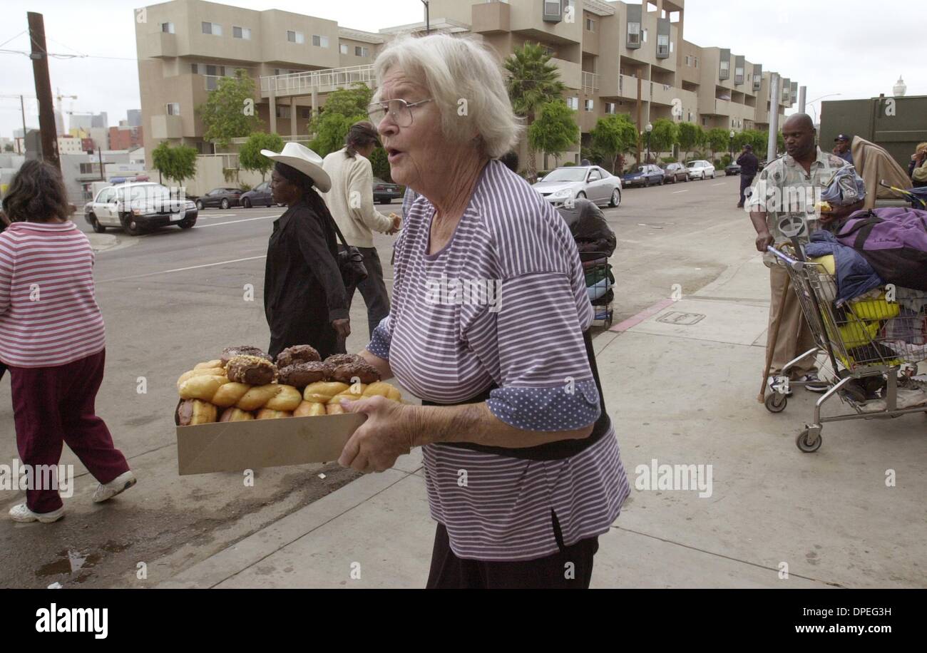 (PUBLISHED 06/15/2004, B-1, UTS1813897) Ailene Tucker hands out donuts ...
