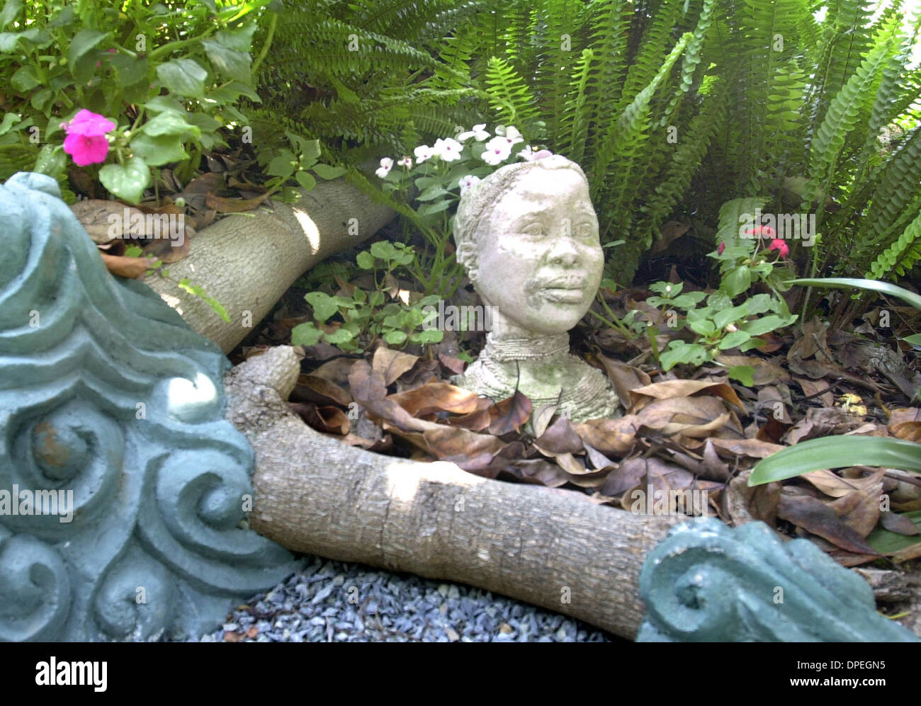 (Published 07/16/2003, NI-6): Clay sculptures of a head and decorative ...
