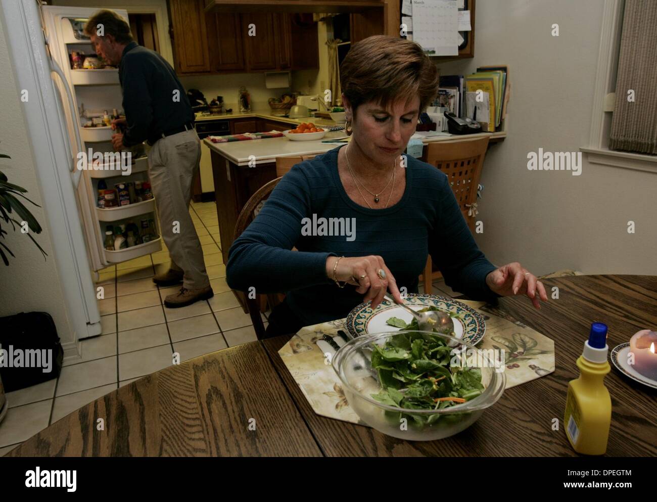 (Published 5/10/2005, E-1) Caren Duncanson (cq) spoons rice and salad ...