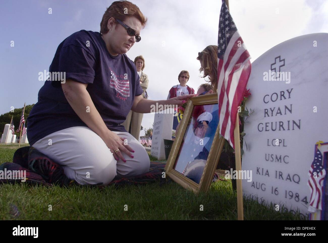 Published 5/29/05 (G: 1) Darlene Geurin, touched the photo of her son ...