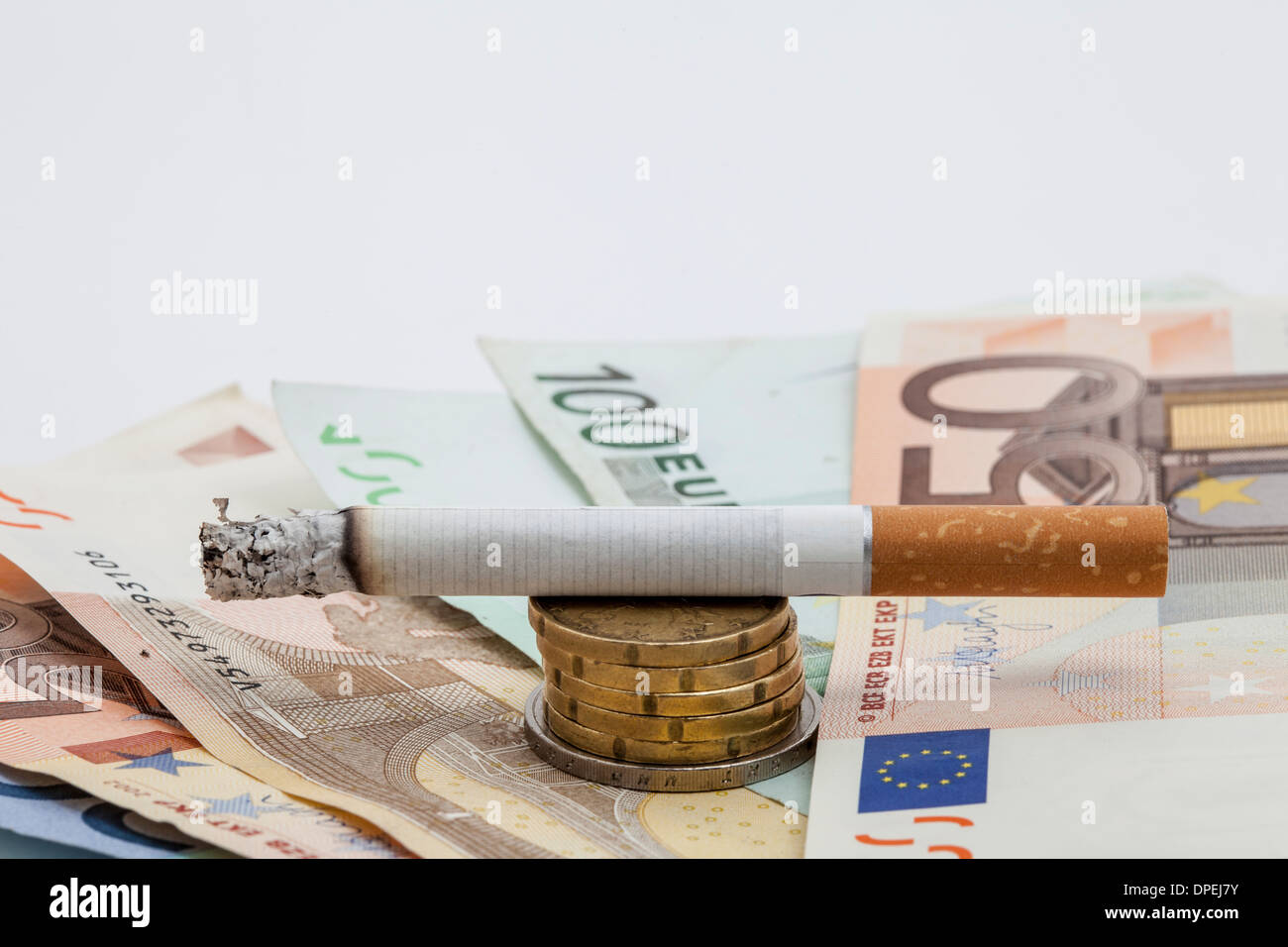 cigarette and money Stock Photo - Alamy
