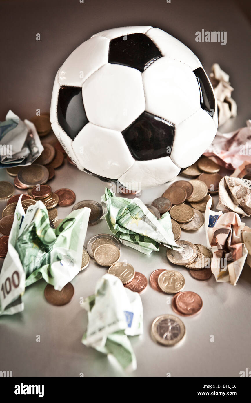 money and soccer ball Stock Photo - Alamy