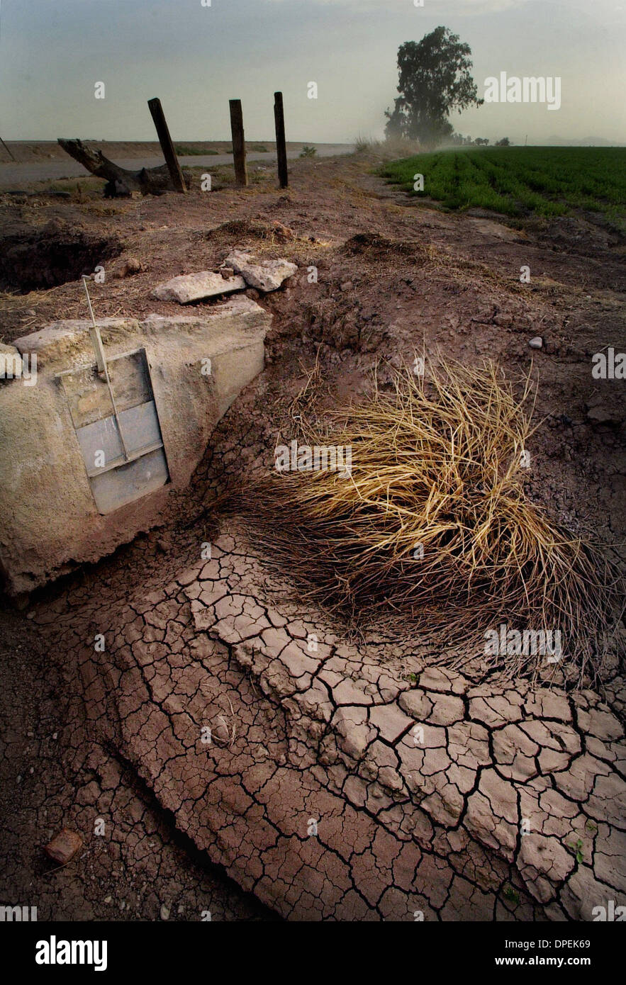 (Published 12/08/2002, A-1) An abandoned irrigation channel beside a ...