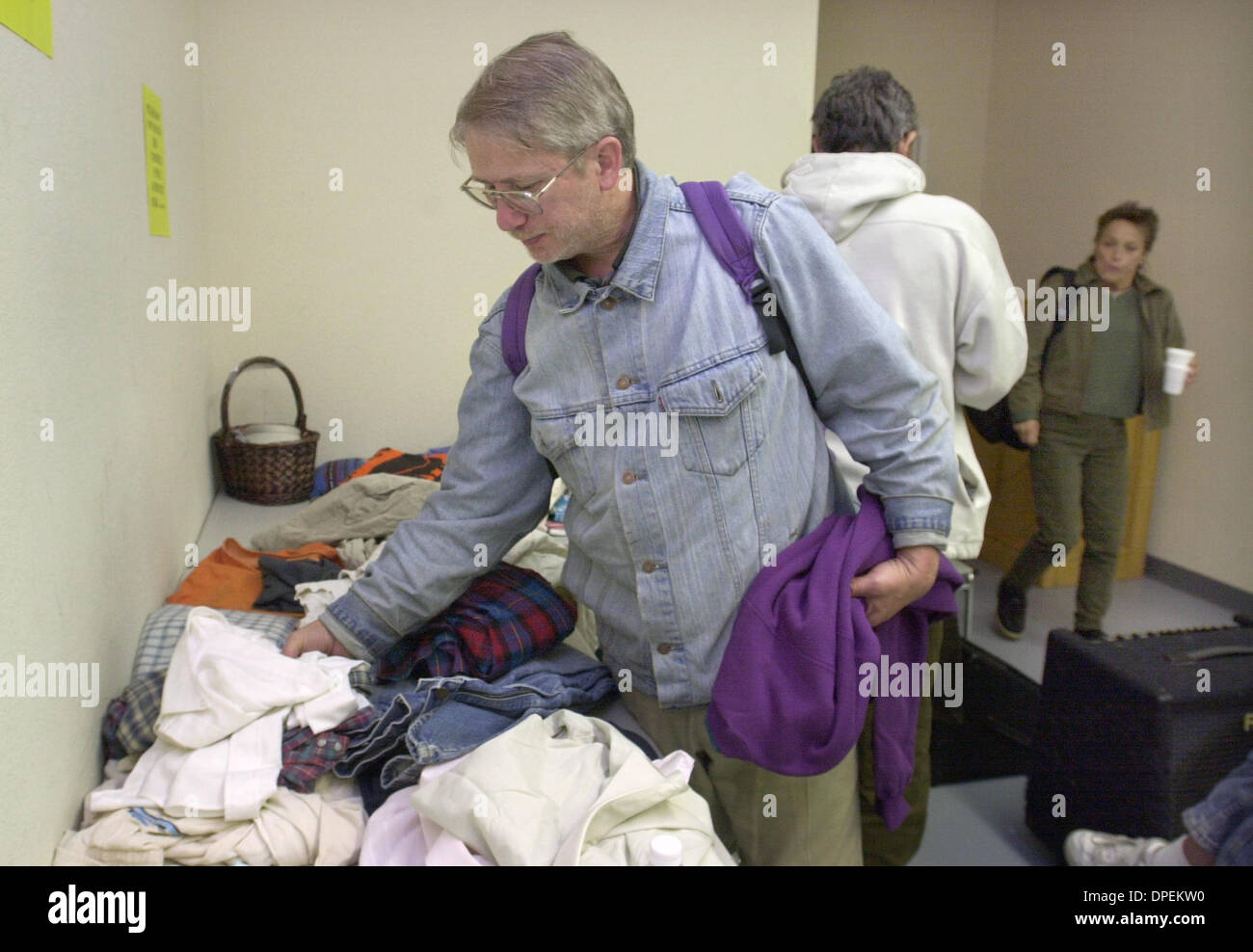 (Published 12/05/2003, NC-3) DANIEL GARVER sorts through donated ...