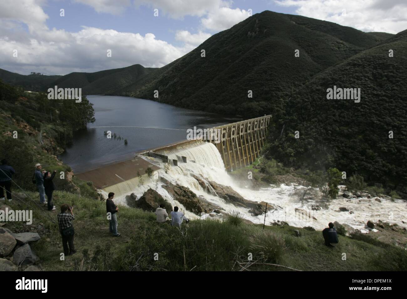(published 2/26/2005, D-2) Wide view of Lake Hodges overflowing its dam ...