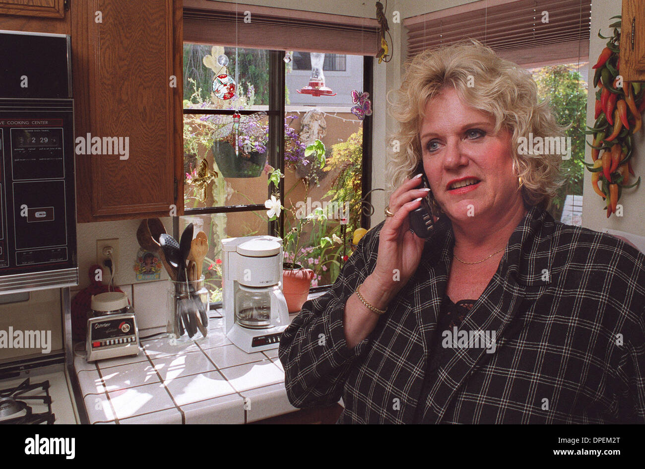 (published 4/8/2005, NC-4) Life coach KATHY NELSON speaks with one of ...