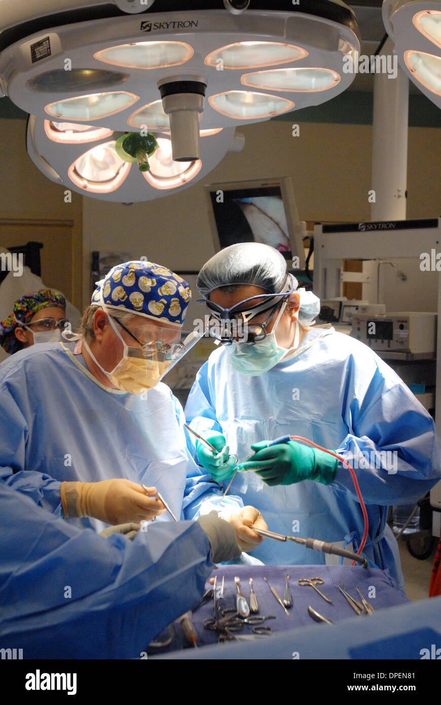From left, Dr. Bryant Toth and Dr. Peter Sun works as a team on an 11 ...