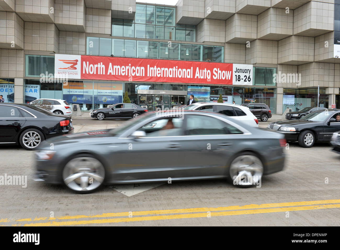 Detroit, USA. 13th Jan, 2014. Vehicles pass the entrance to Cobo Center ...