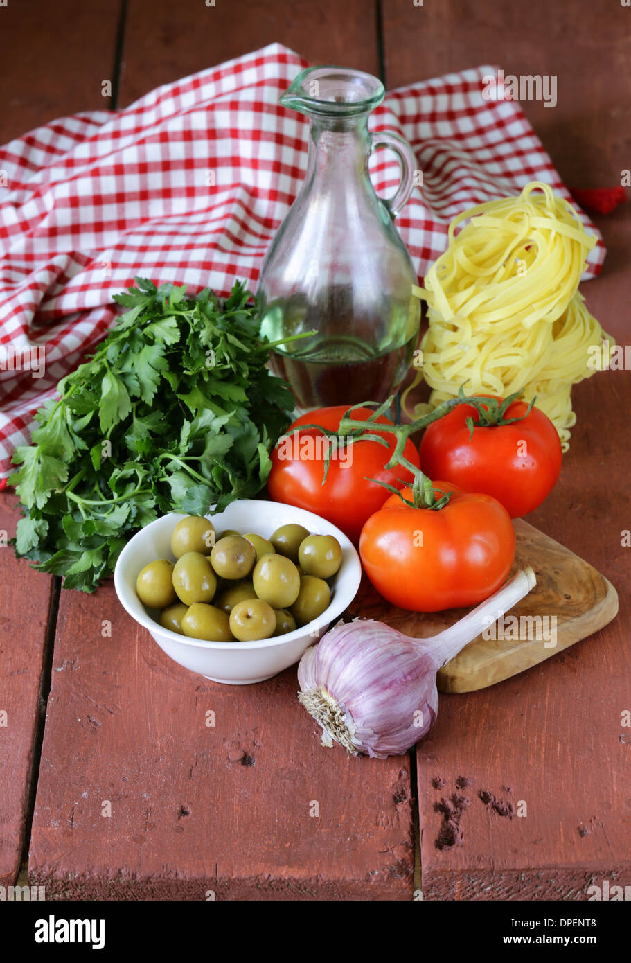 Italian food still life - pasta, olive oil, tomatoes, garlic Stock ...