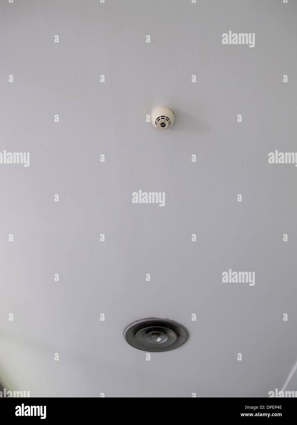 smoke detector and air diffuser on ceiling Stock Photo - Alamy