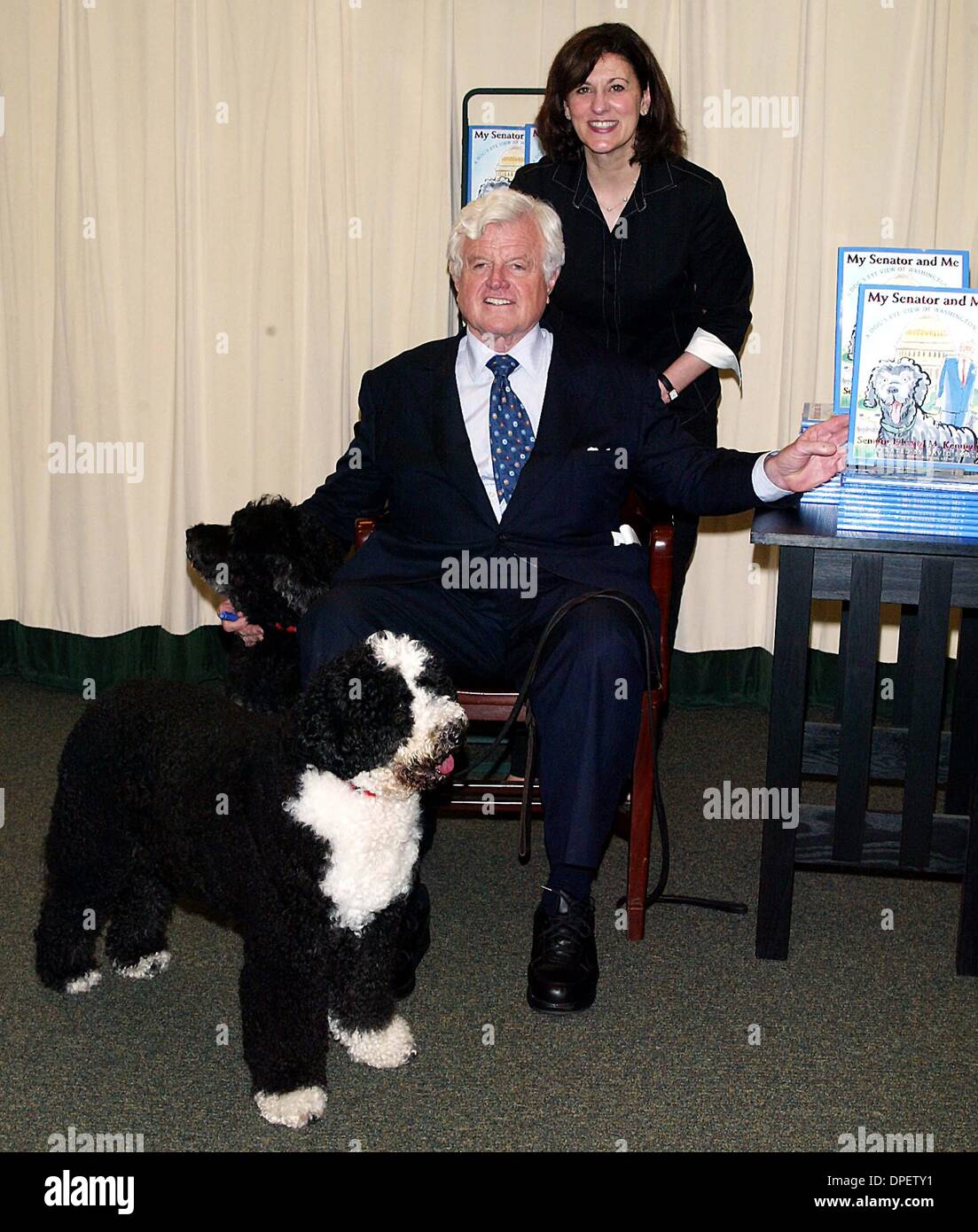 Senator Ted Kennedy (with wife Vickie and dogs Sunny and Splash) signs ...