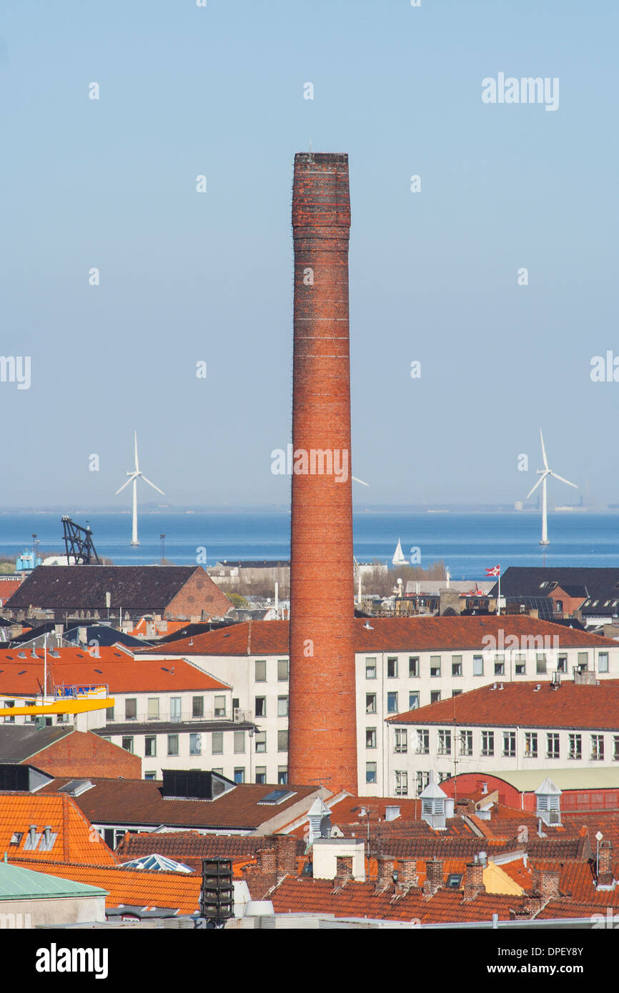 View of old industrial chimney and modern wind turbines from the Round ...