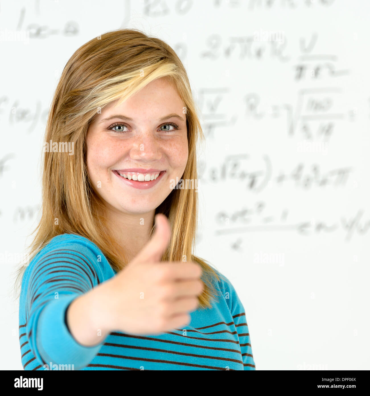 Smiling student girl thumb up standing front of mathematics board Stock ...