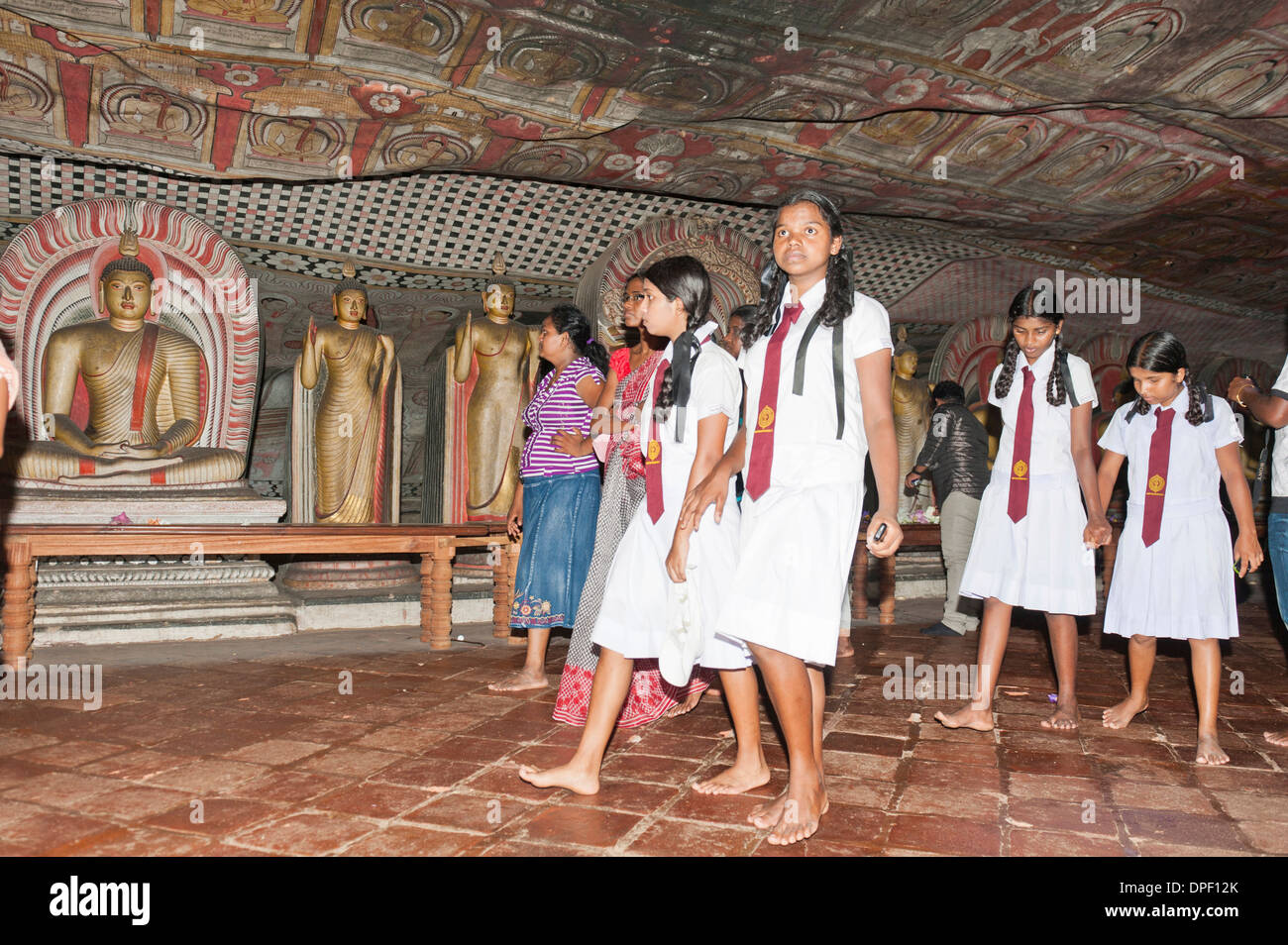 Girls, school children visiting the temple, Buddha statues, colourful ...