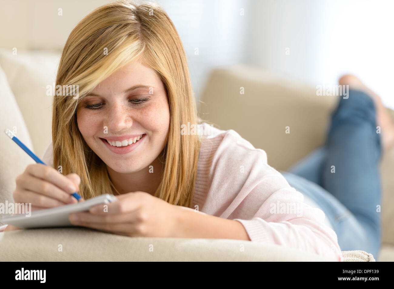 Teenage girl writing on hi-res stock photography and images - Alamy