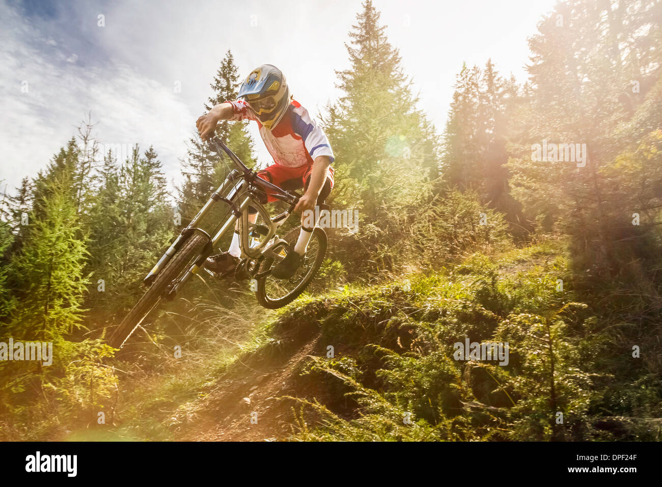 Mountain biker doing jump Stock Photo - Alamy