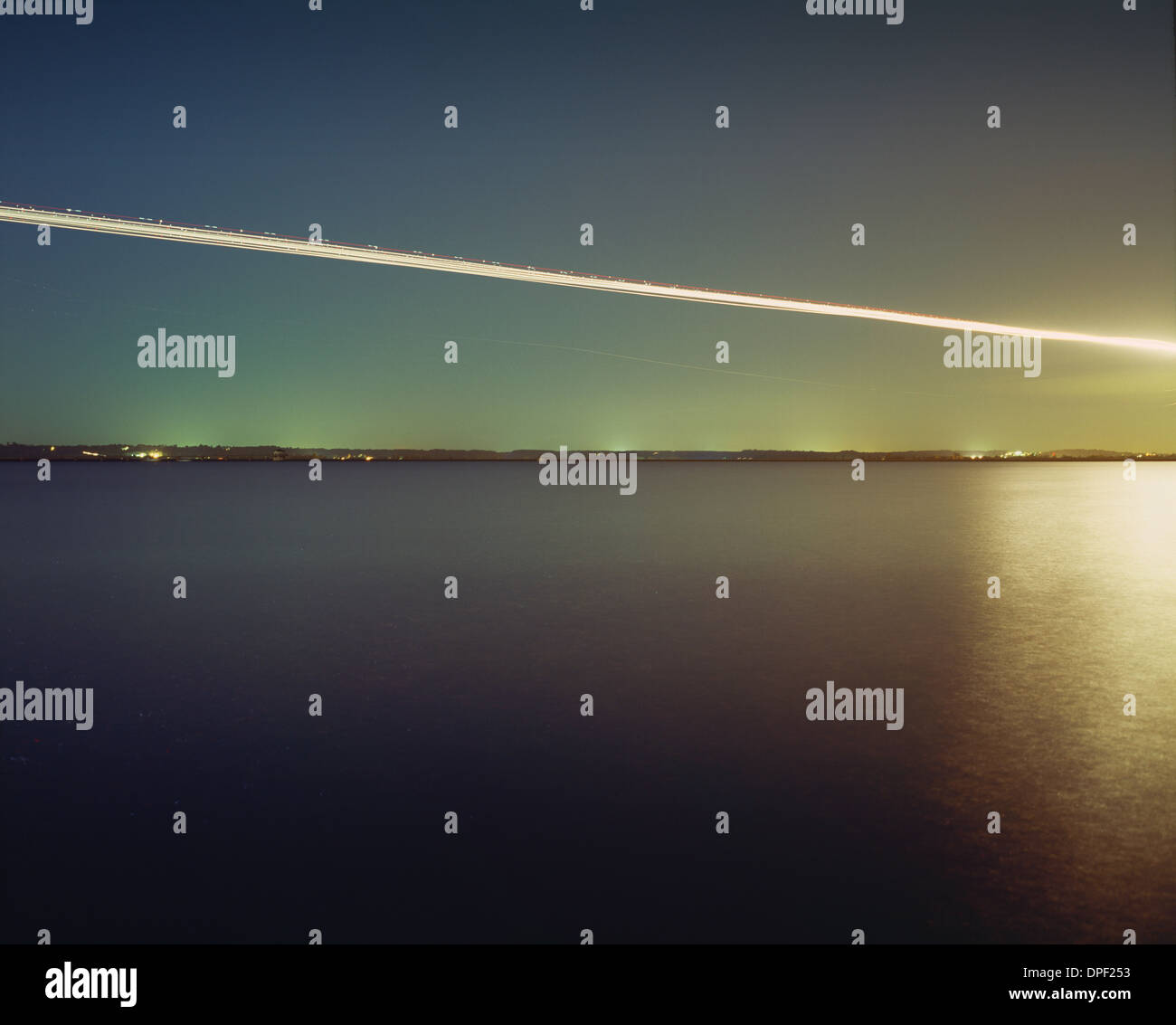 Light trail over water from airborne transport Stock Photo - Alamy