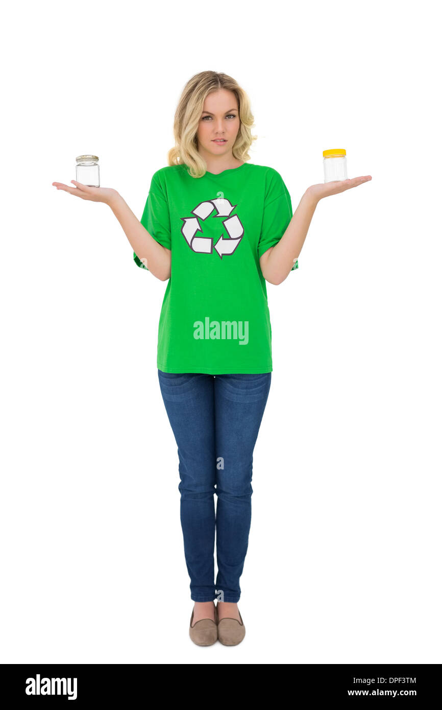 Serious cute environmental activist holding glass jars Stock Photo - Alamy