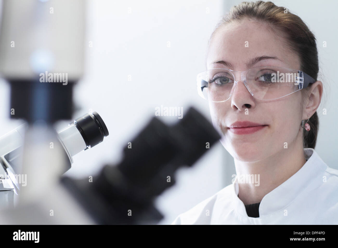 Young female scientist in white hi-res stock photography and images - Alamy
