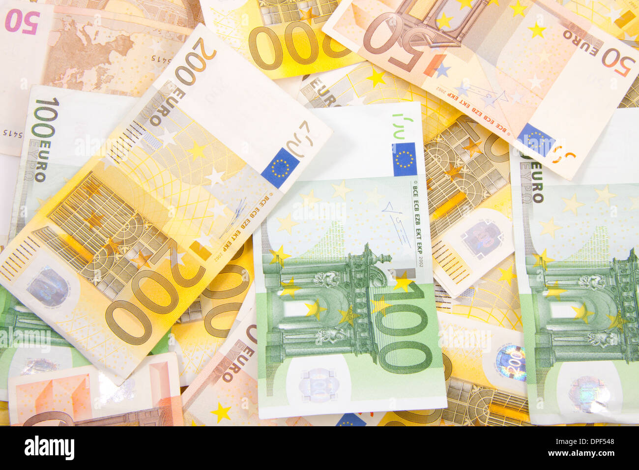 Lots of bank notes on a pile isolated for background use Stock Photo ...