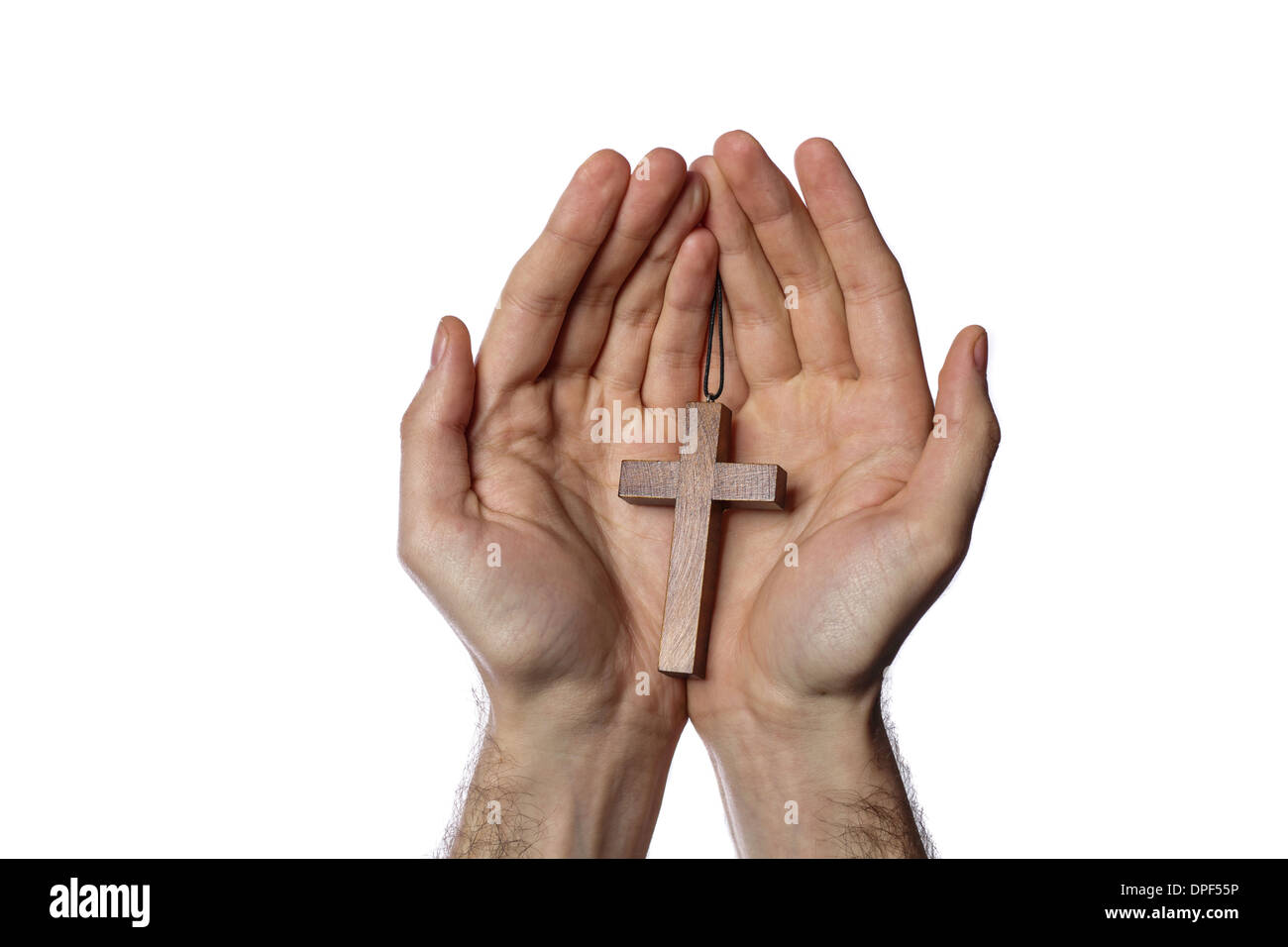 Male hands holding wooden cross on white background Stock Photo - Alamy