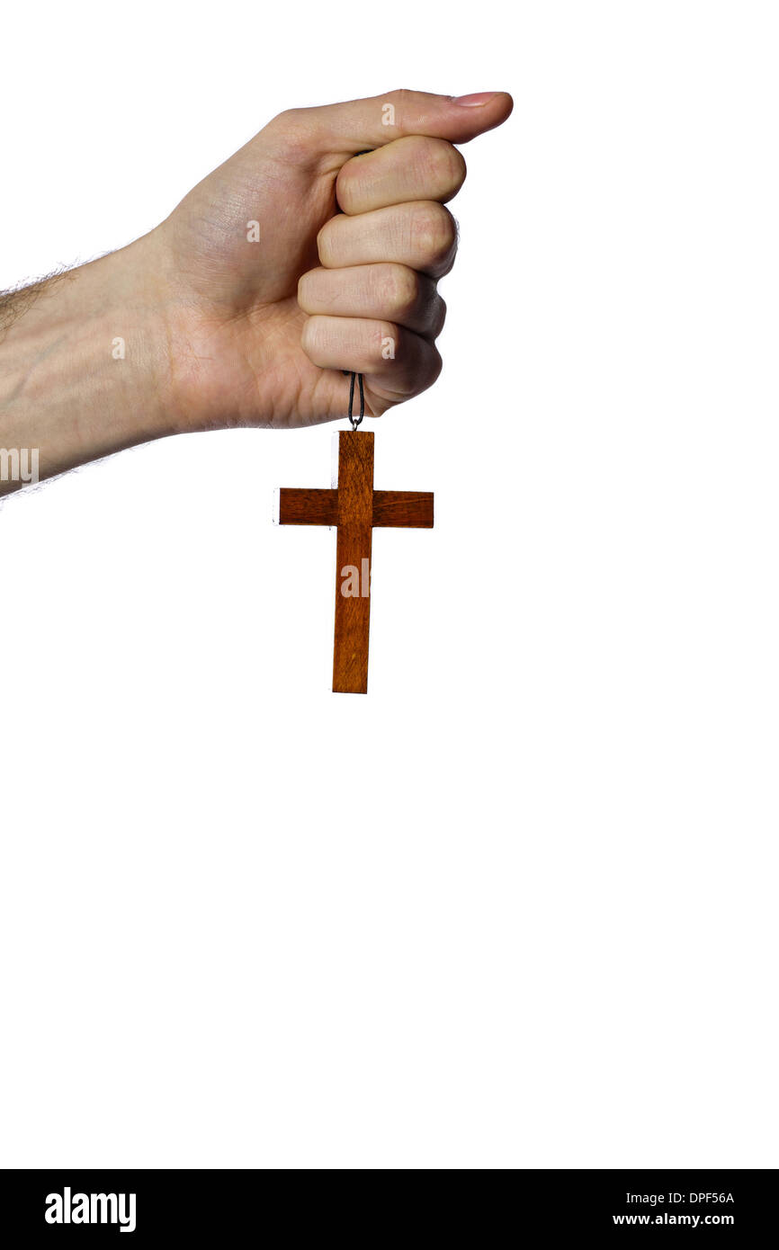 Male hand holding wooden cross on white background Stock Photo - Alamy