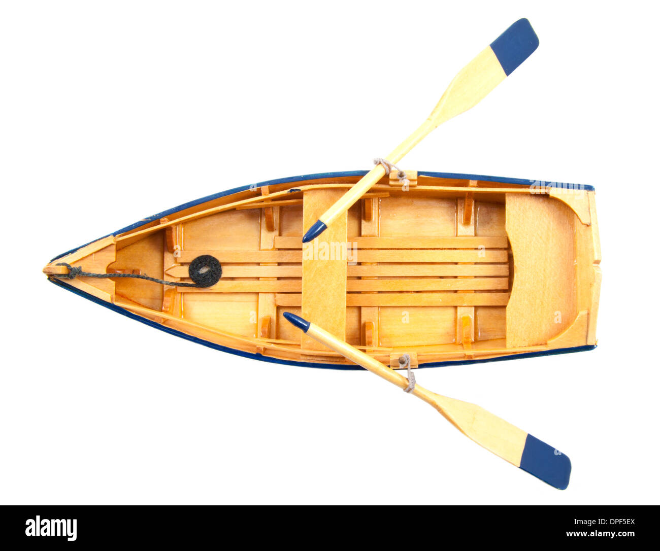 Wooden boat with paddles isolated over white Stock Photo - Alamy