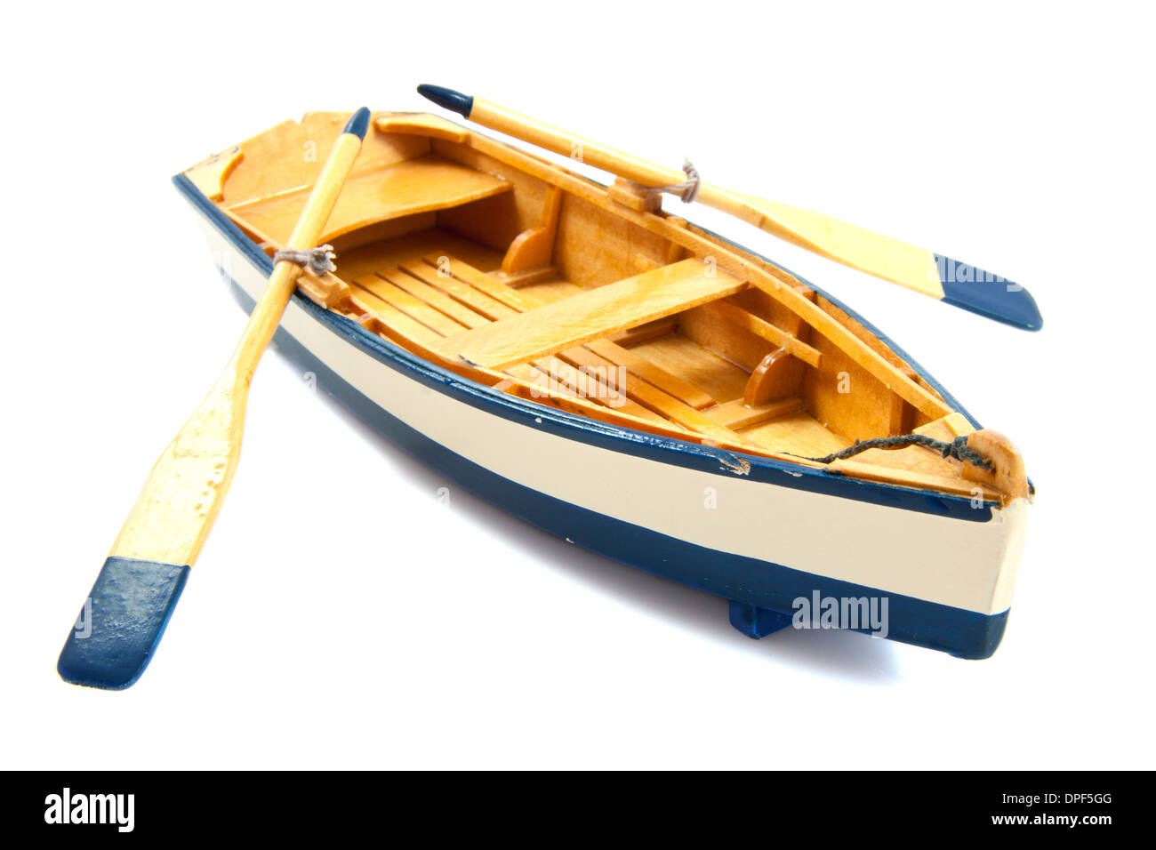 Wooden boat with paddles isolated over white Stock Photo - Alamy
