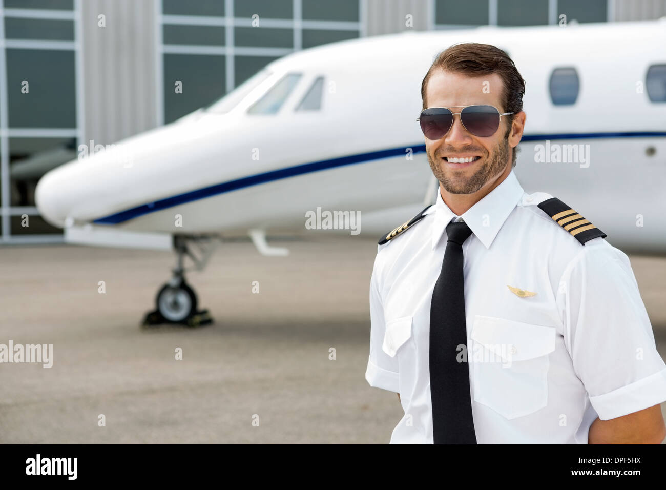 Confident Pilot Smiling Stock Photo - Alamy