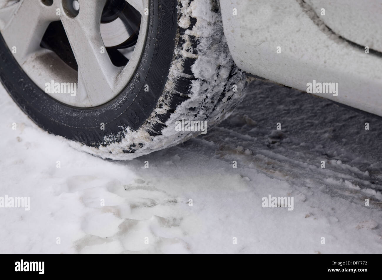 Wheel of a car on snow Stock Photo - Alamy