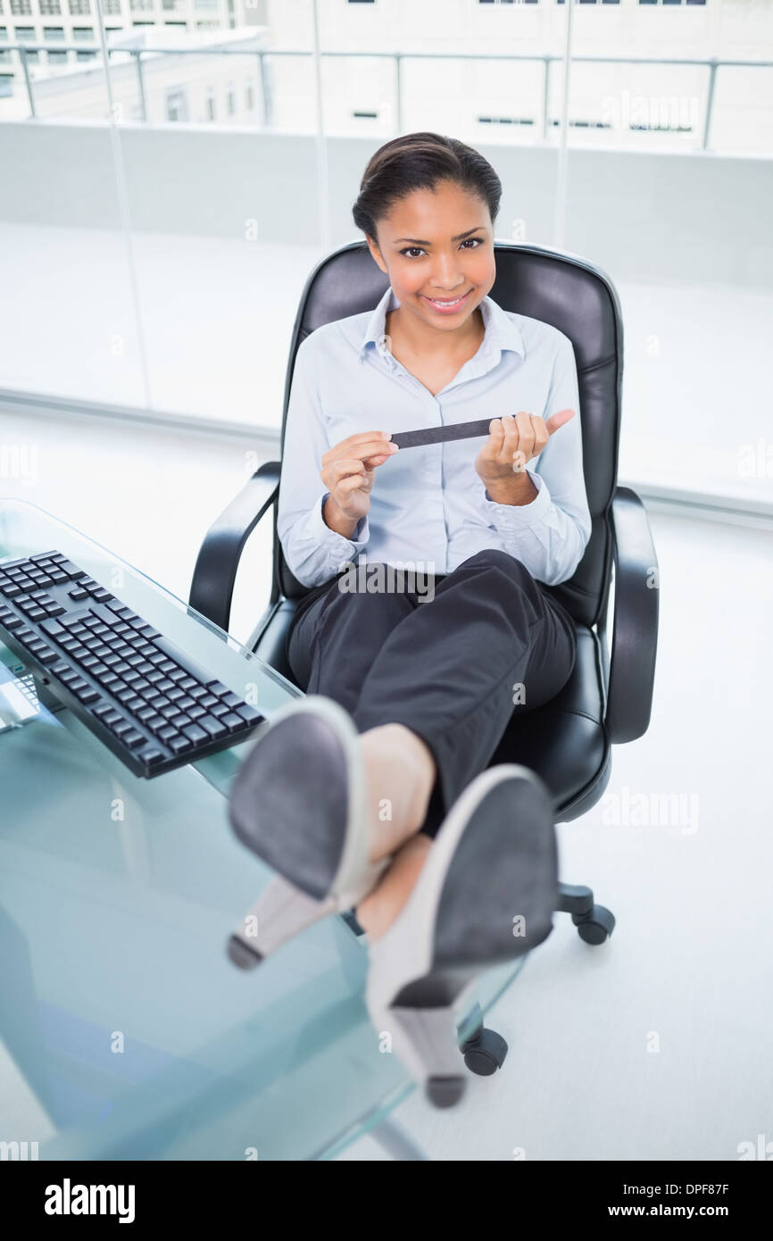 Business woman filing nails office hi-res stock photography and images ...