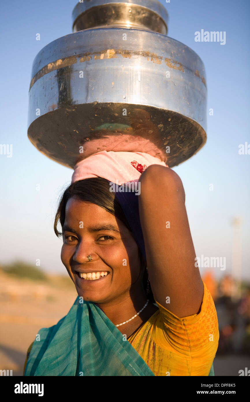 Young woman collecting water, Jaisalmer, Western Rajasthan, India, Asia Stock Photo - Alamy