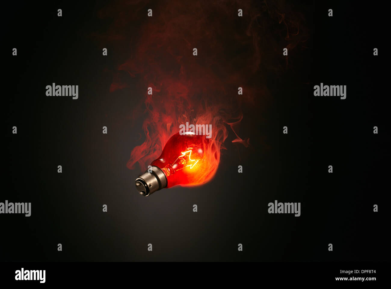 Still life of red smoking illuminated lightbulb Stock Photo - Alamy