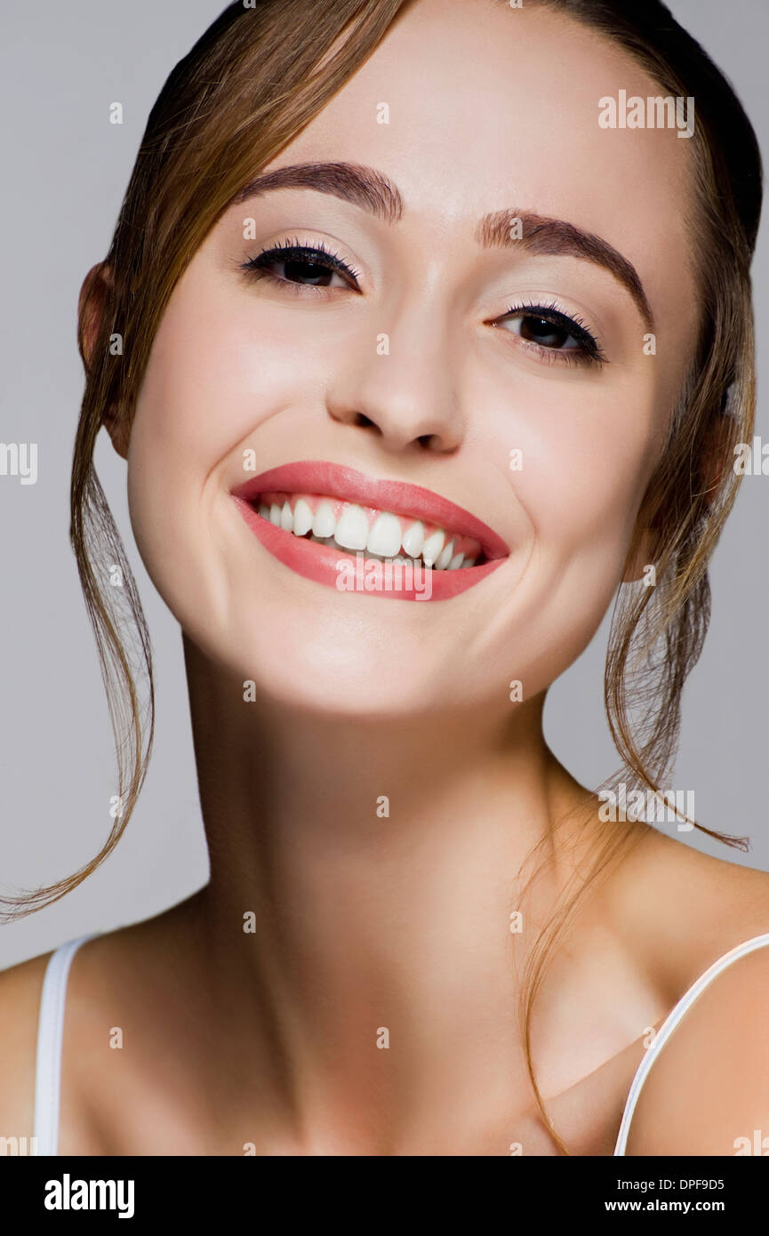 Studio portrait of young beautiful smiling woman Stock Photo - Alamy