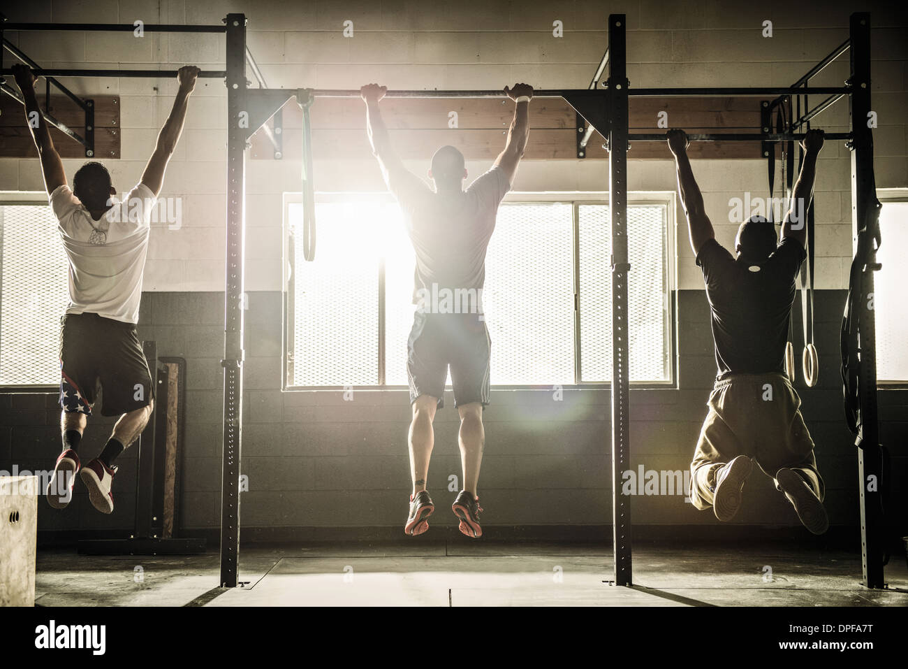 Man bar pull ups hi-res stock photography and images - Alamy