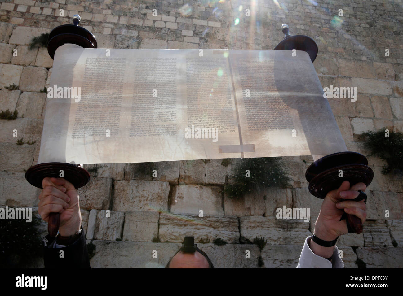A ceremonial reading of the Torah from Torah scroll under the Western ...