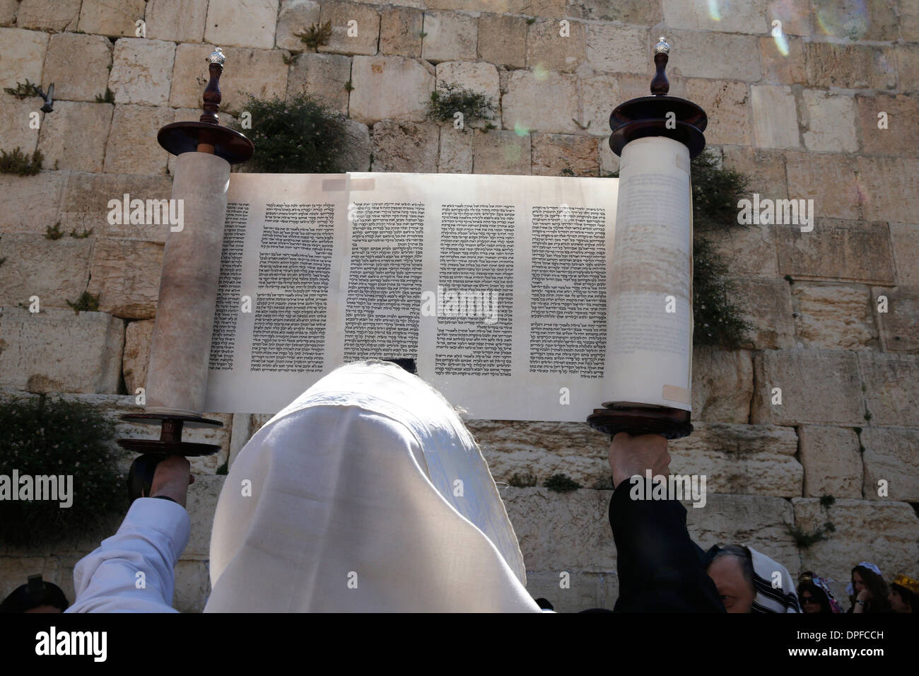 A ceremonial reading of the Torah from Torah scroll under the Western ...